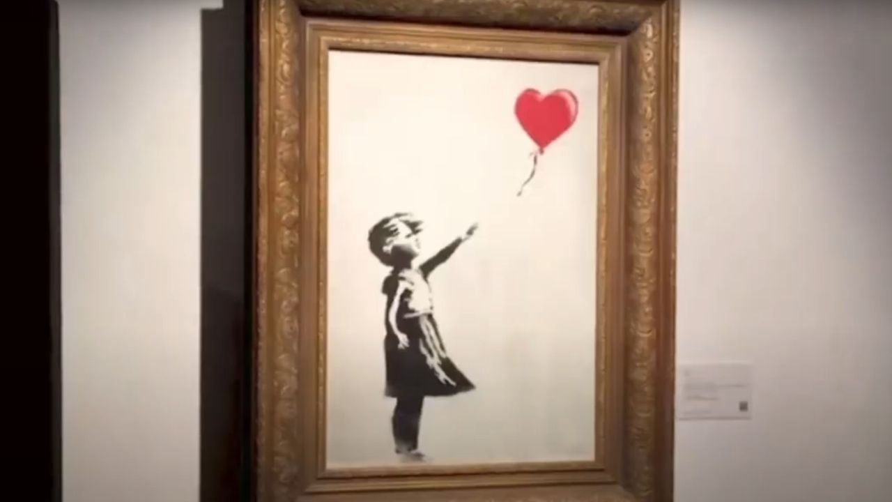 Girl with Balloon Explained: The Meaning Behind Banksy’s Graffiti